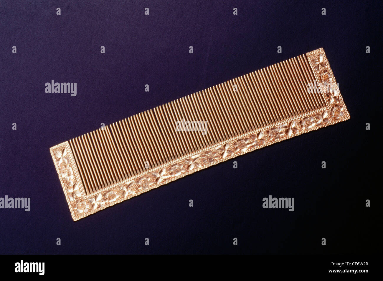 Gold comb ; old antique sixty years old gold comb ; india ; asia Stock ...
