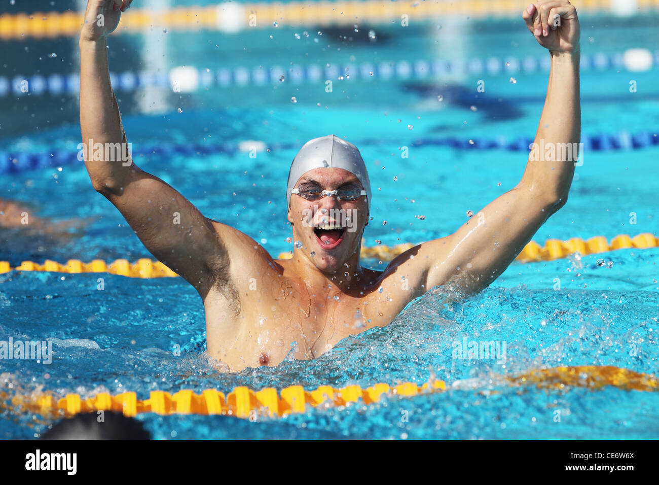 Swimmer Celebrating Success in Swimming Pool Stock Photo - Alamy