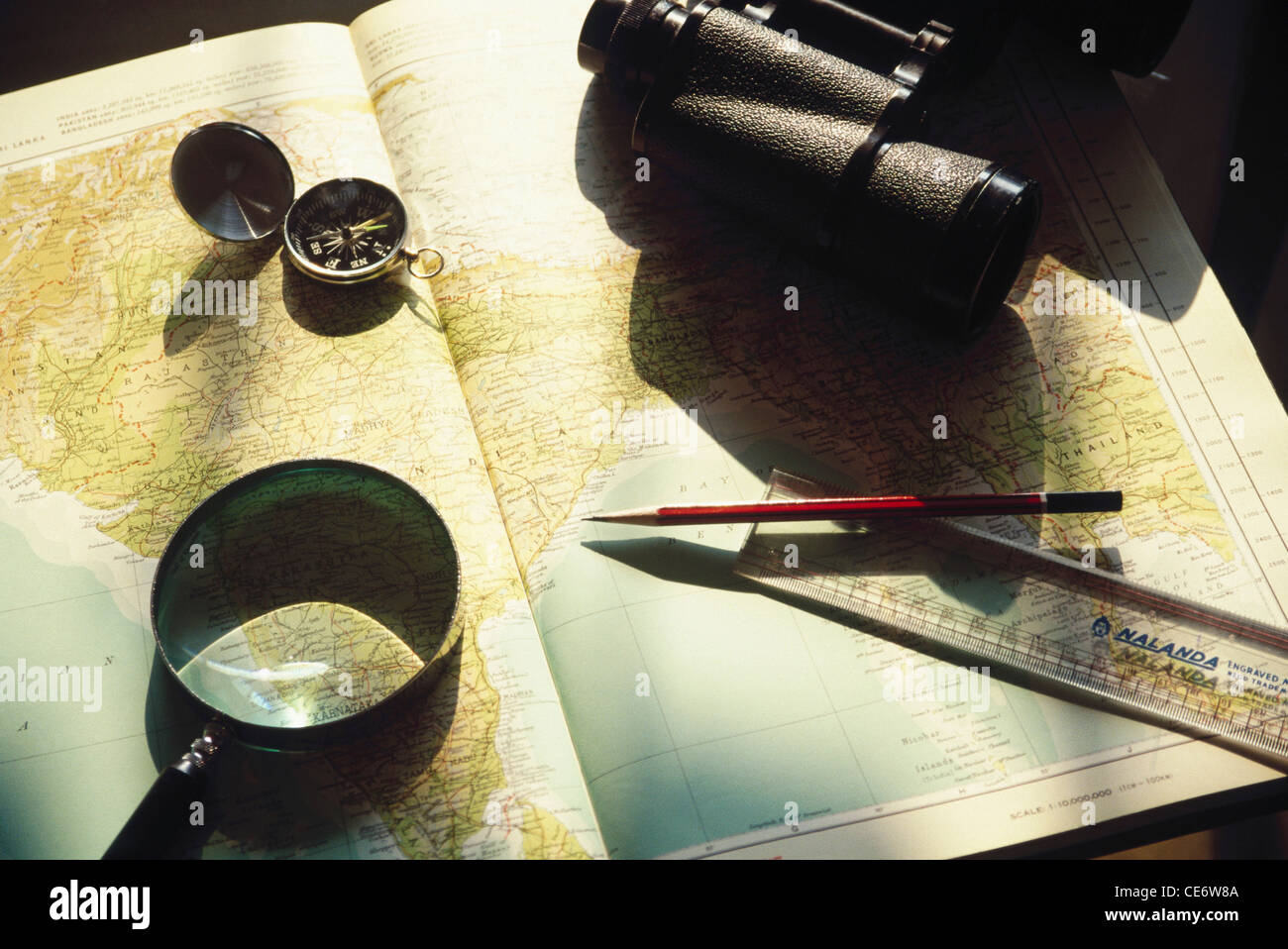 Navigation compass map magnifier binoculars pencil ruler Stock Photo ...