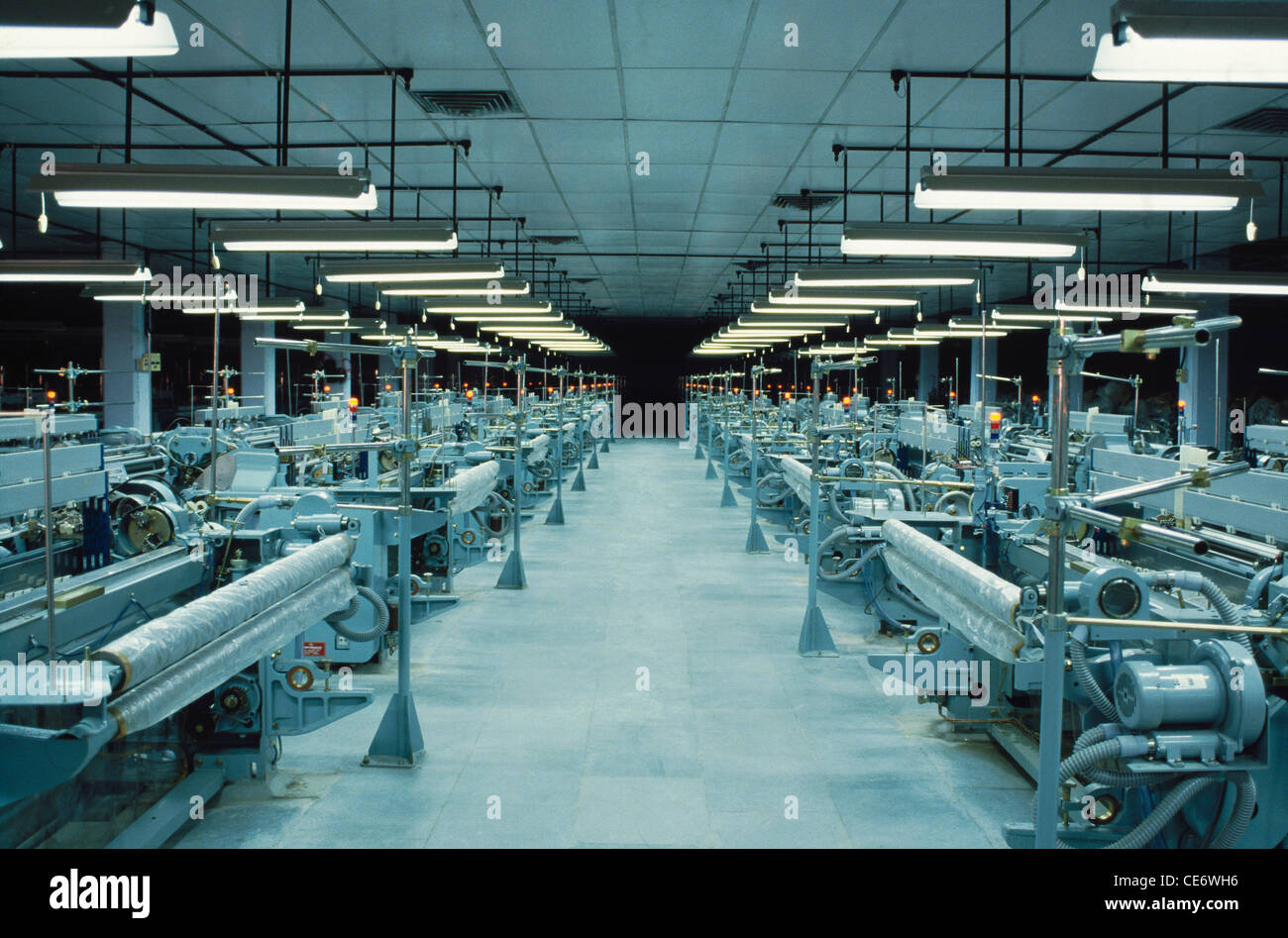 Automatic weaving looms in textile factory india Stock Photo - Alamy