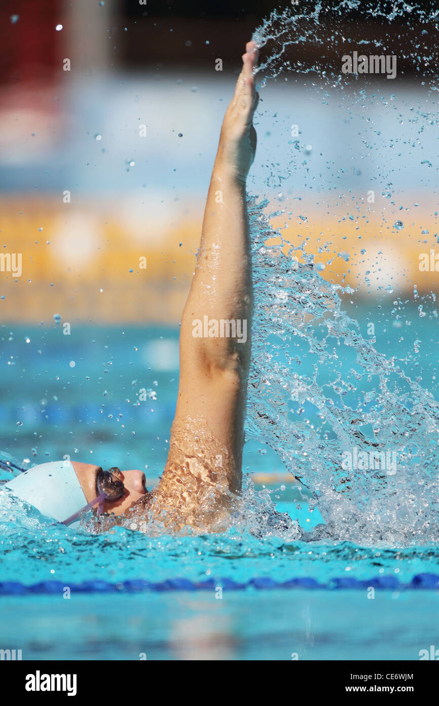 Women swimming in pool with blue cap hi-res stock photography and ...