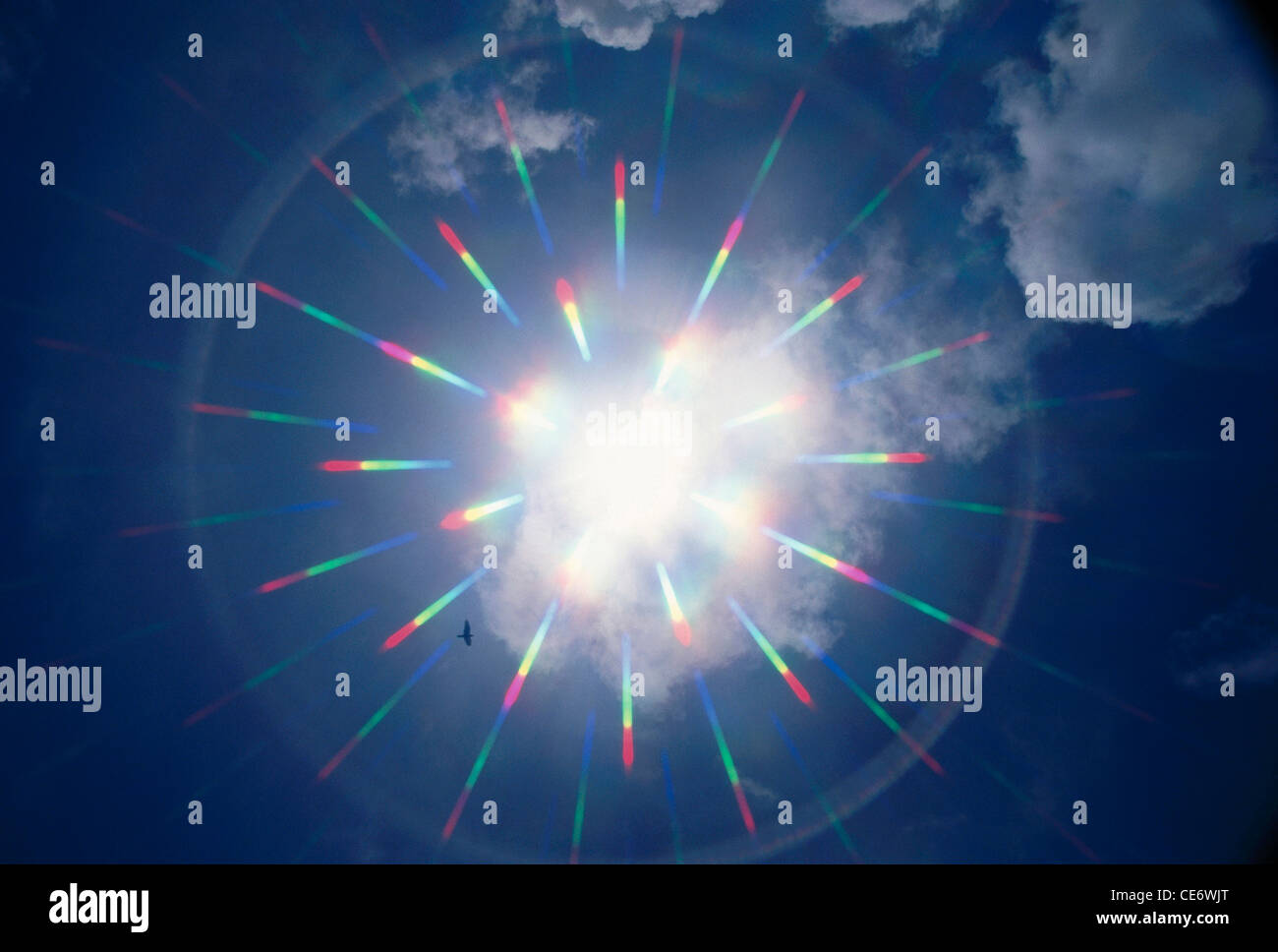 VHM 86015 : sunburst sun rays sky rainbow effect Stock Photo - Alamy