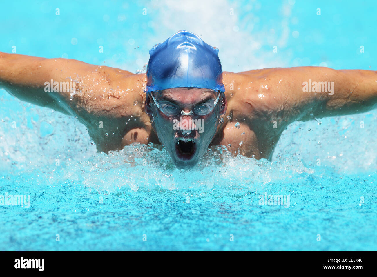 Young Man Swimming Butterfly Stroke Stock Photo - Alamy