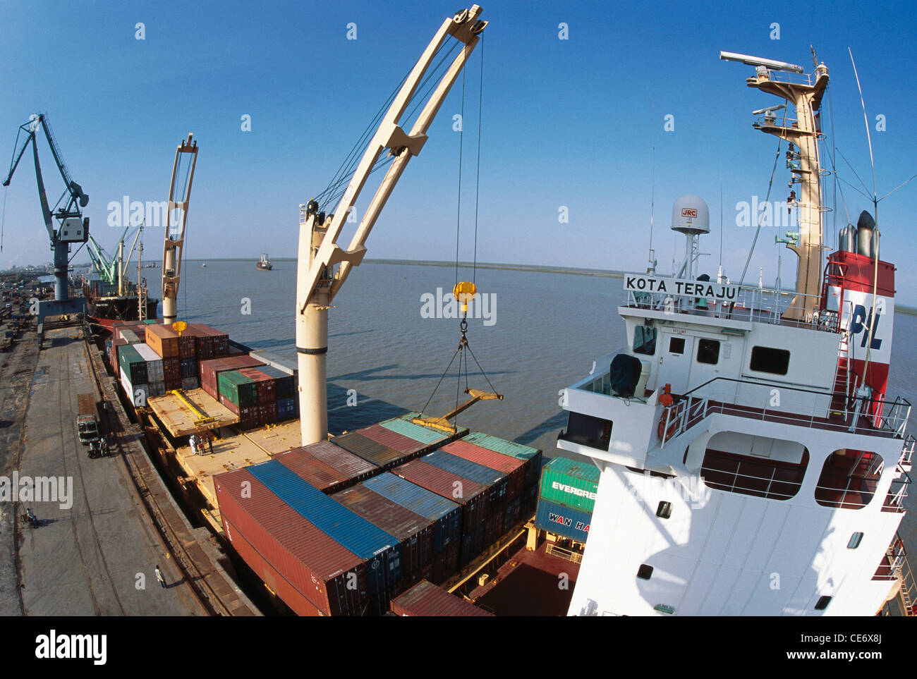 Cranes loading containers on PIL ship Kota Teraju kandla port gujarat ...