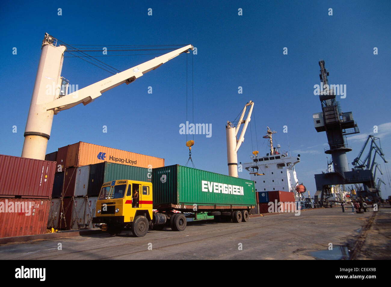 HMA 85484 : large cranes loading imported containers from ship on truck ...