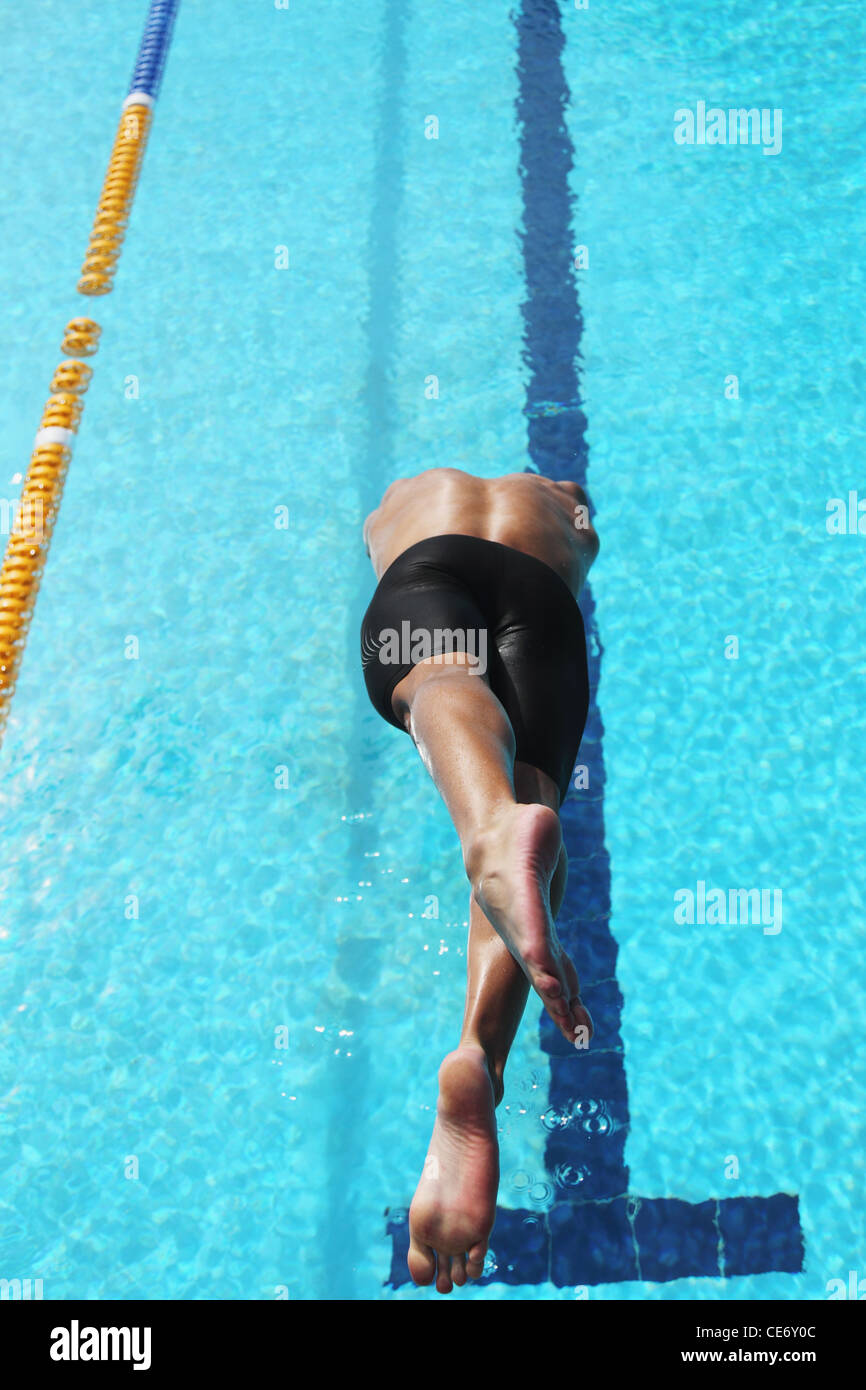 Young Man Diving into Swimming Pool Stock Photo - Alamy