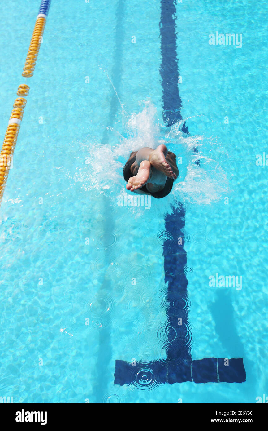 Young Man Diving into Swimming Pool Stock Photo - Alamy
