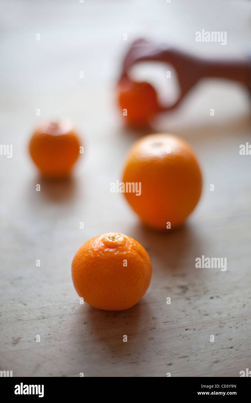Child's hand reaching for orange Stock Photo - Alamy