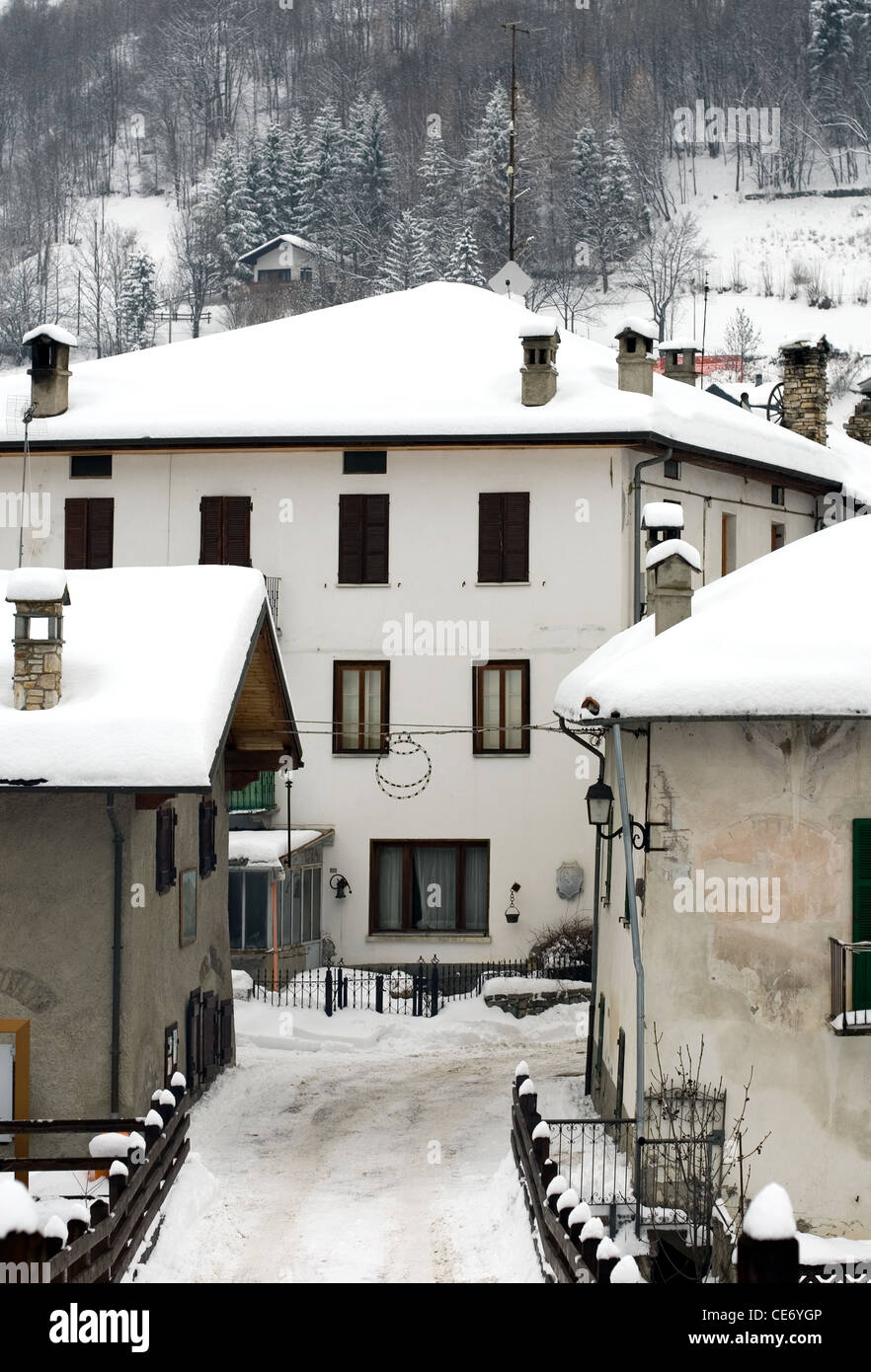 A narrow street in a small village in the Italian Alps Stock Photo - Alamy