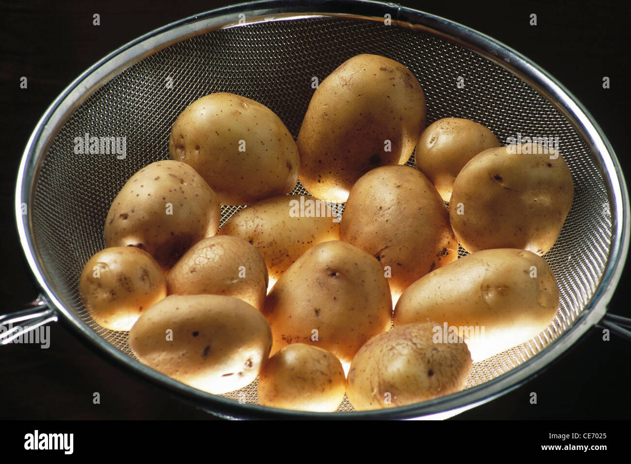 Vegetable potato ; fourteen potatoes in mesh bowl ; india ; asia Stock ...