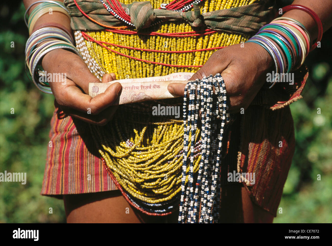 HMA 83940 : tribal woman wearing beads holding money paper notes ten ...