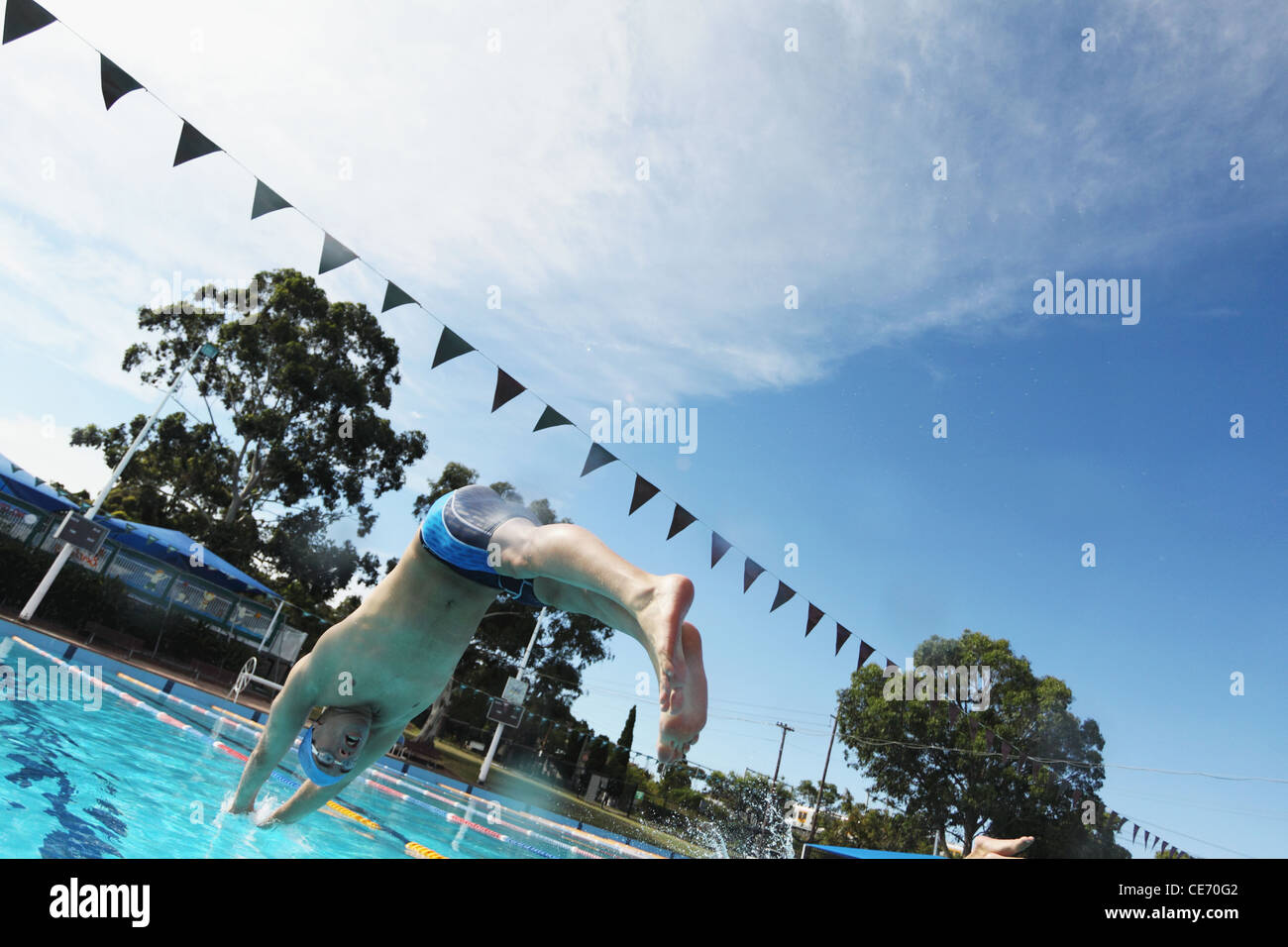 Swimmer Diving into Pool Stock Photo - Alamy