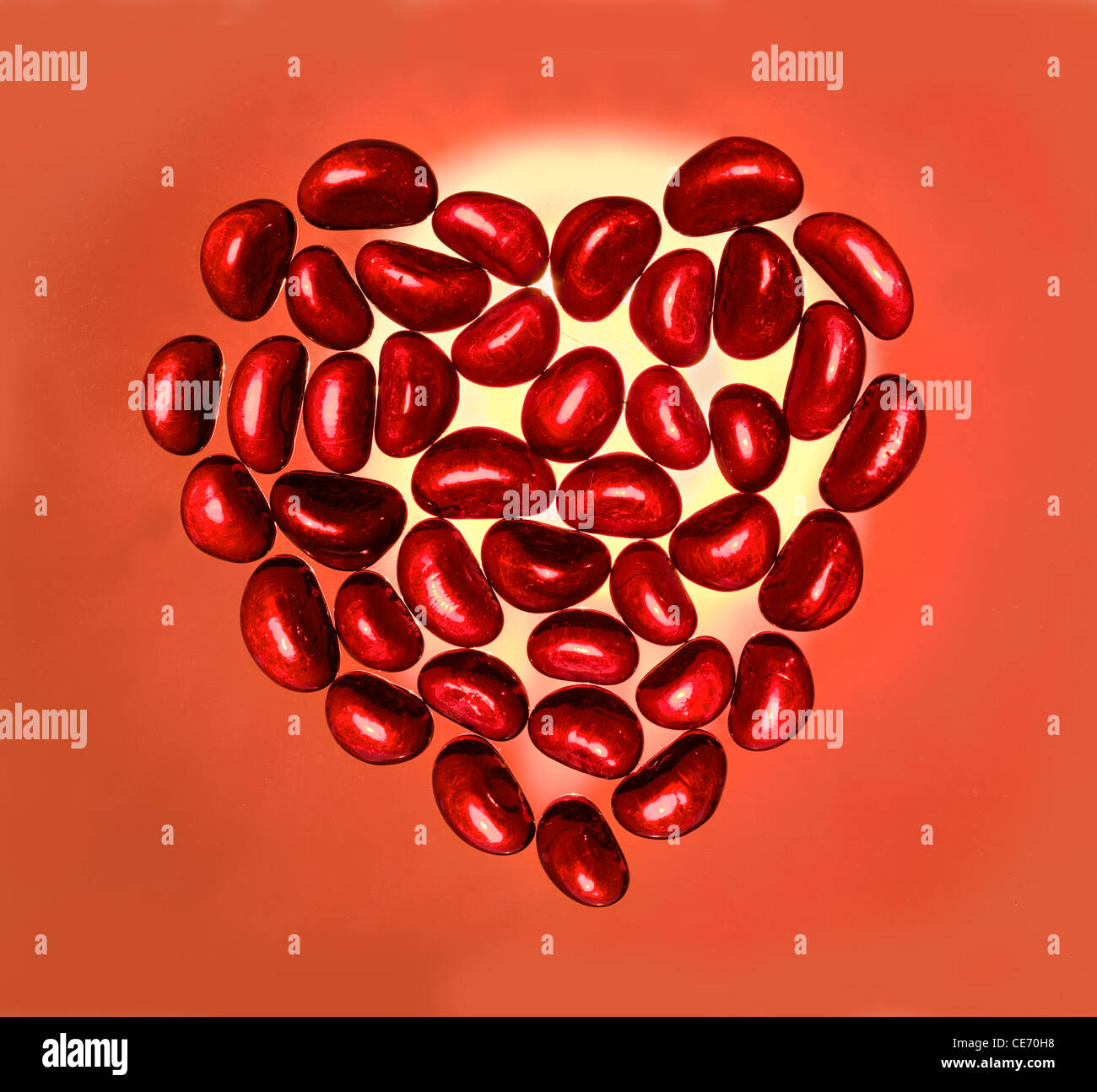 Red hot heart on the red background Stock Photo - Alamy