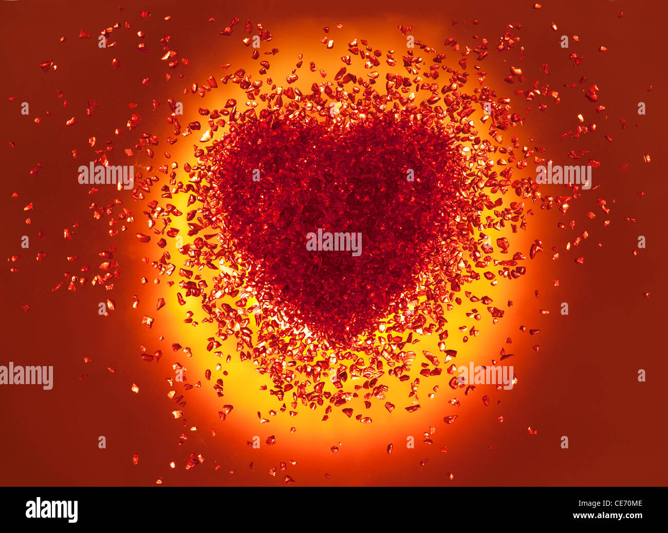 Hot red heart on red background Stock Photo - Alamy