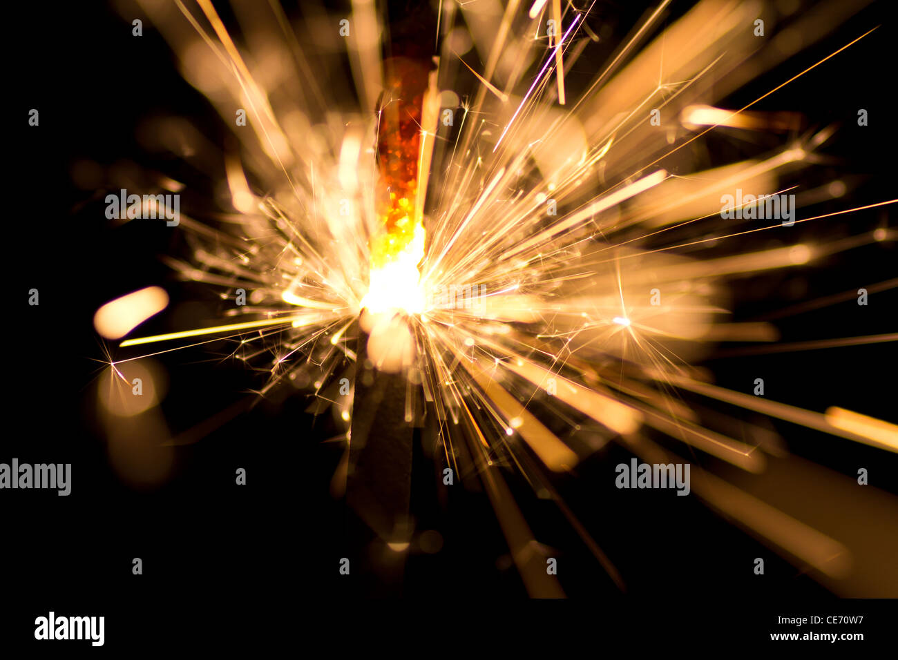 Closeup of a sparkling piece of firework against a black background ...