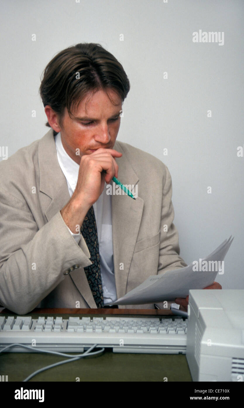man in office reading papers Stock Photo - Alamy man in office reading papers Stock Photo - Alamy