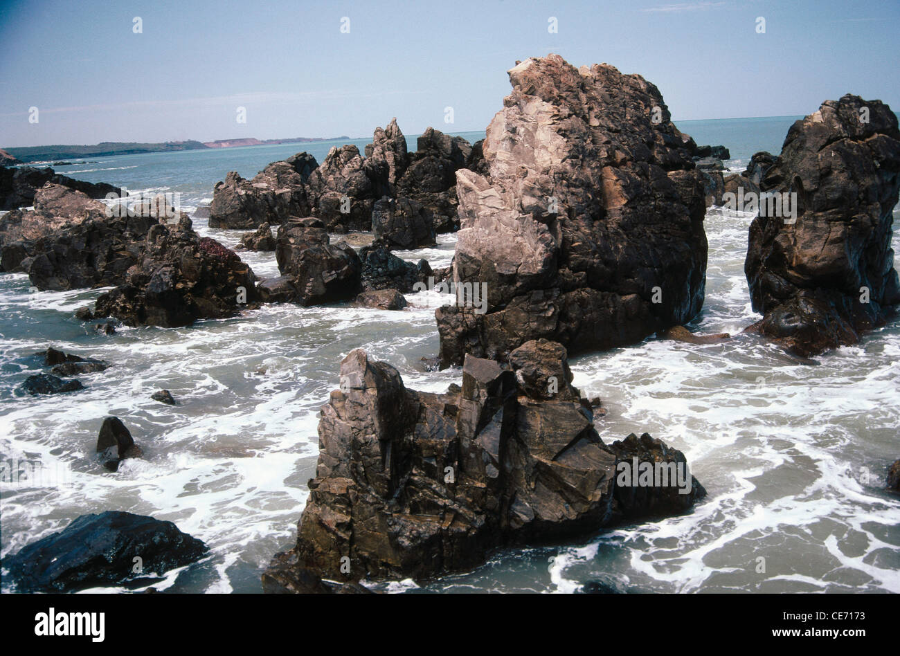 AMA 82459 : rocky beach rocks sea surf sky goa india Stock Photo - Alamy