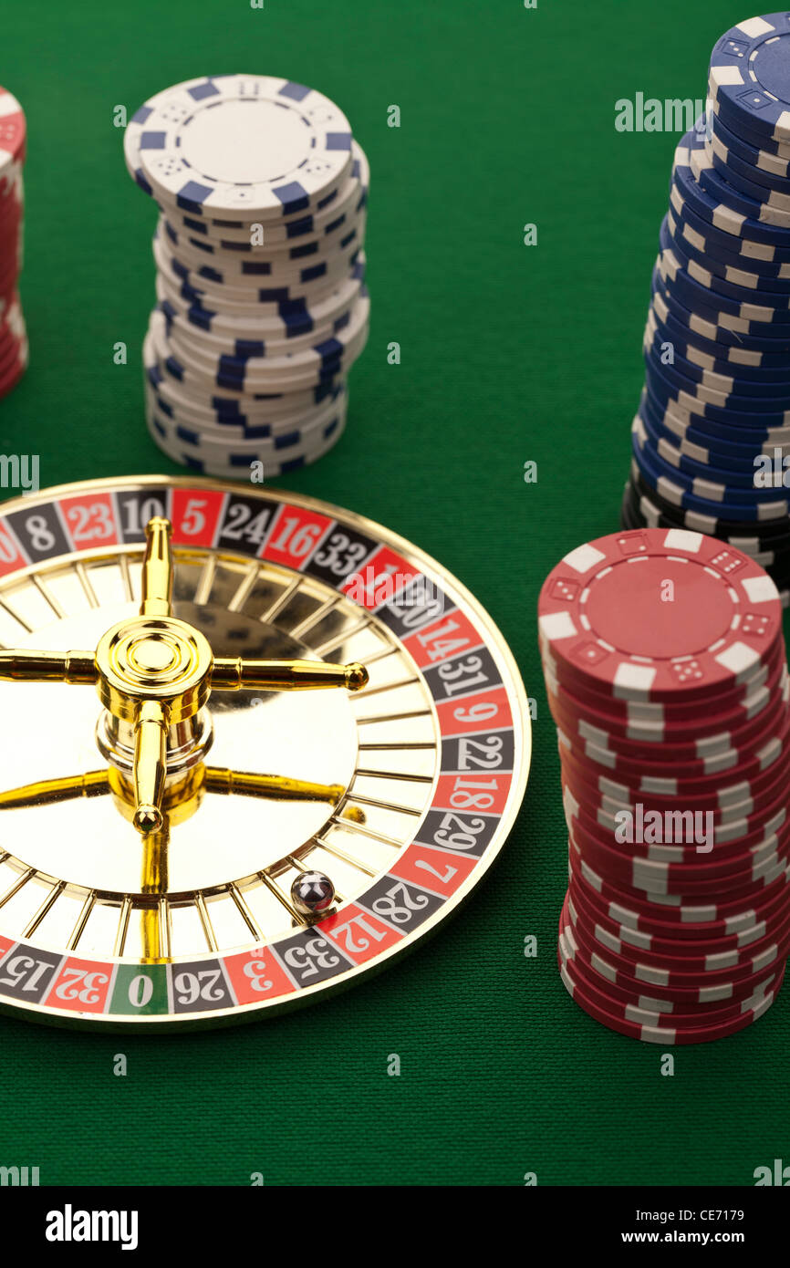 Beautiful gold roulette on a green background Stock Photo - Alamy