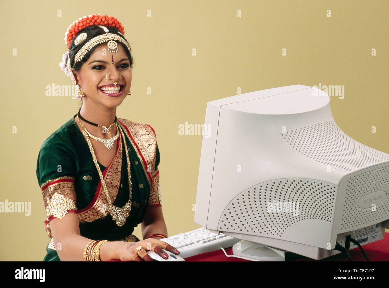 RMM 84149 : South Indian women happy excited working operating computer ...