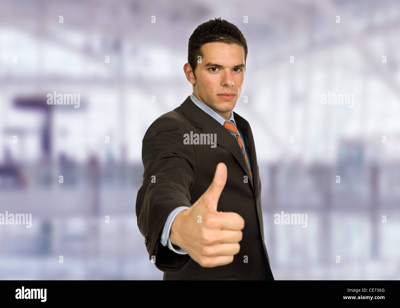 young business man going thumb up Stock Photo - Alamy