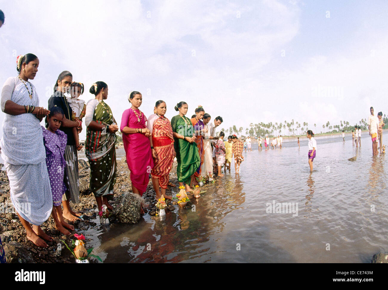 AAD 82841 : indian women praying to the sea on Coconut festival day ...