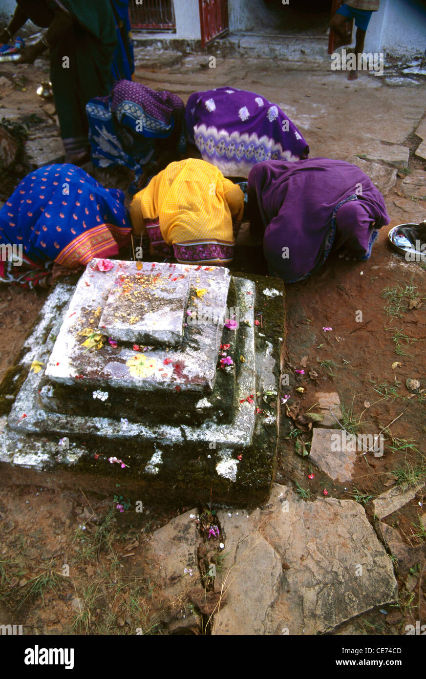 Hindu women bowing in front of deity ; madhya pradesh ; india ; asia ...
