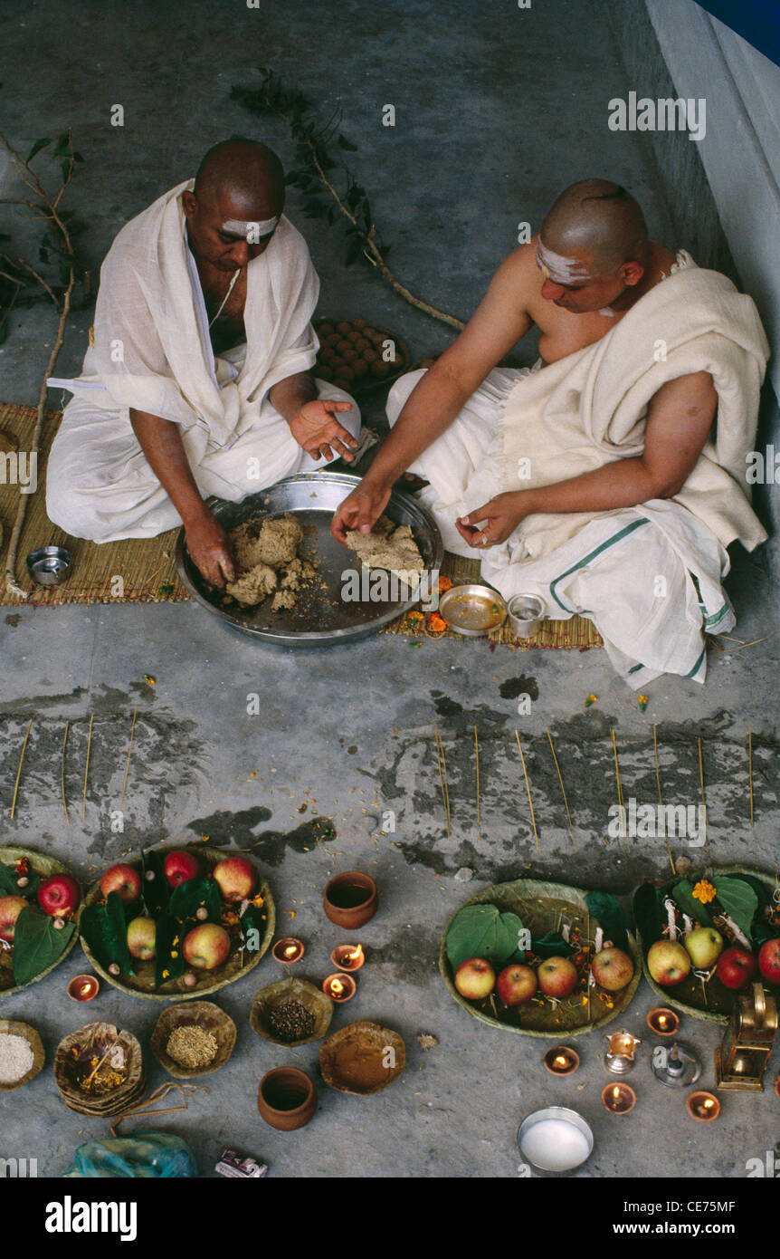 RVA 83084 : two indian hindu sanyasi priests preparing for pooja puja ...