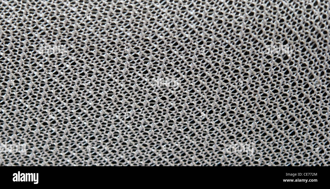 metal net on black background Stock Photo - Alamy