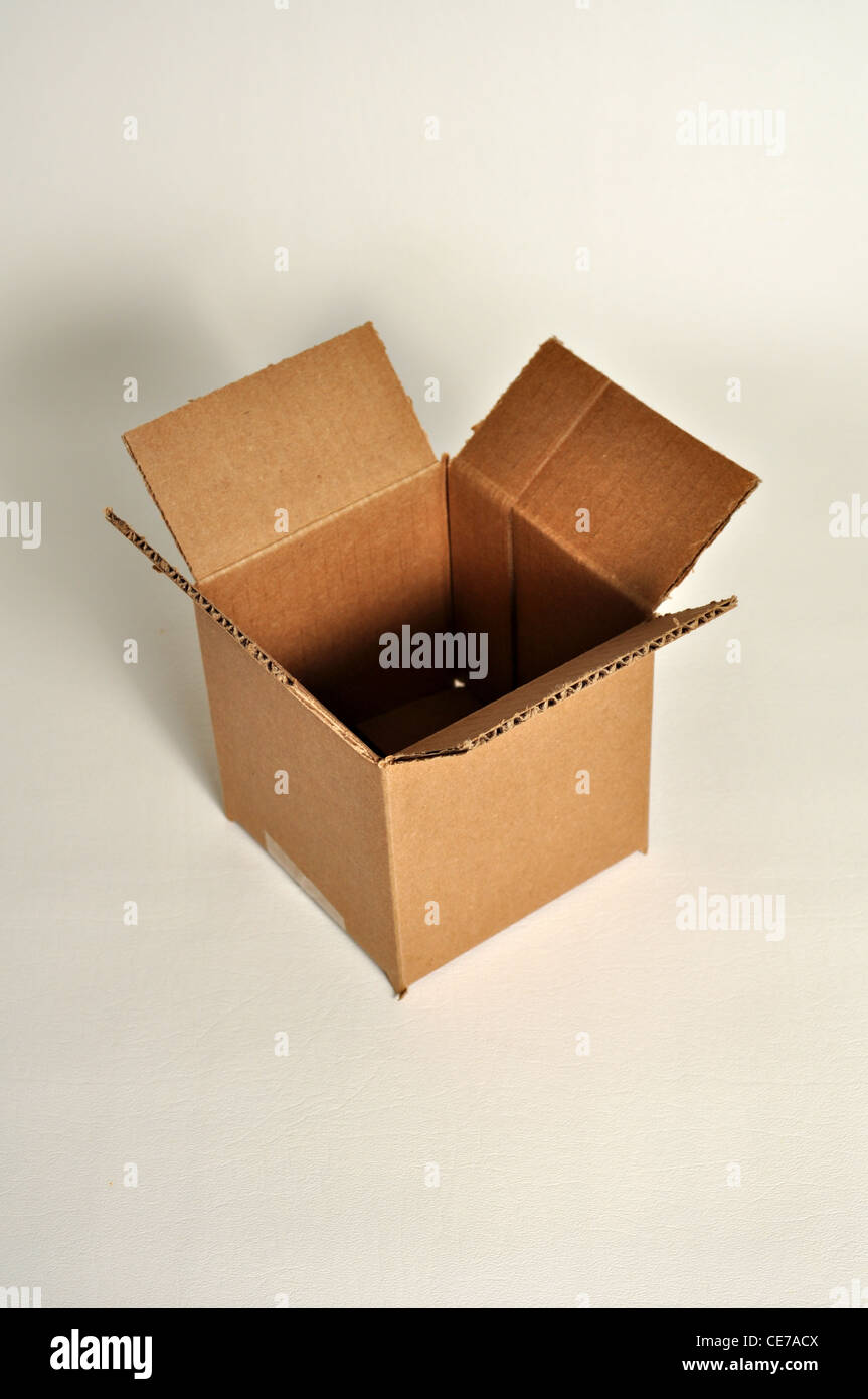 A empty cardboard box sits on a white background Stock Photo - Alamy