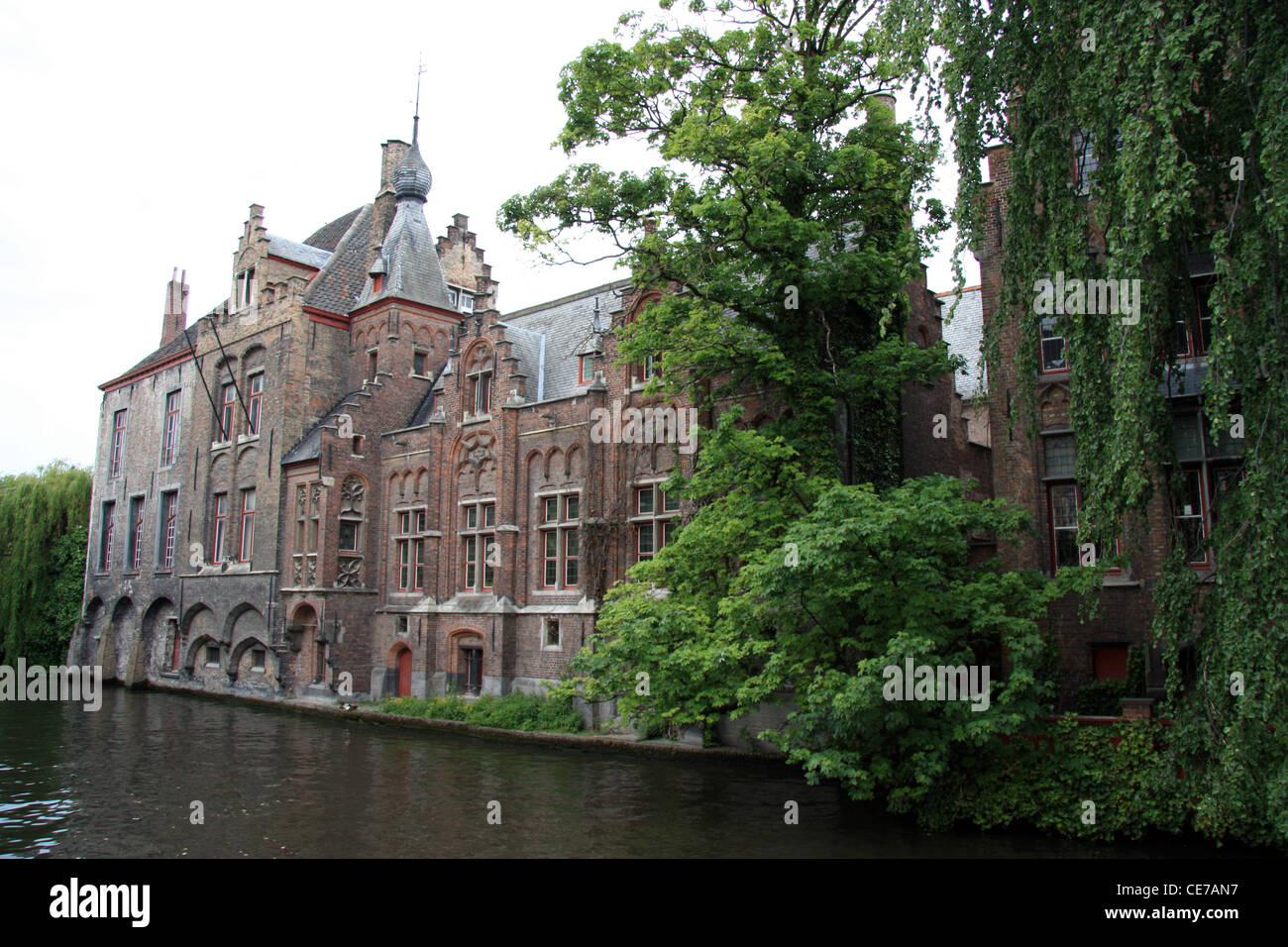 traditional flemish house on water channel in bruges, Belgium Stock ...