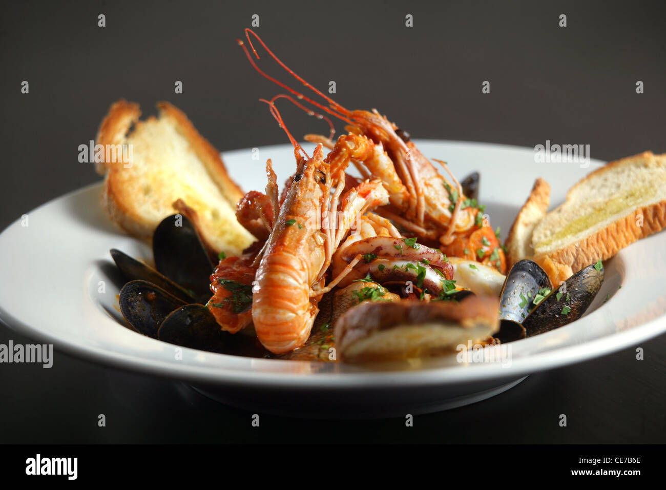 SAUTEED MUSSELS AND PRAWNS WITH CHILLI, GARLIC AND ROSEMARY Stock Photo ...
