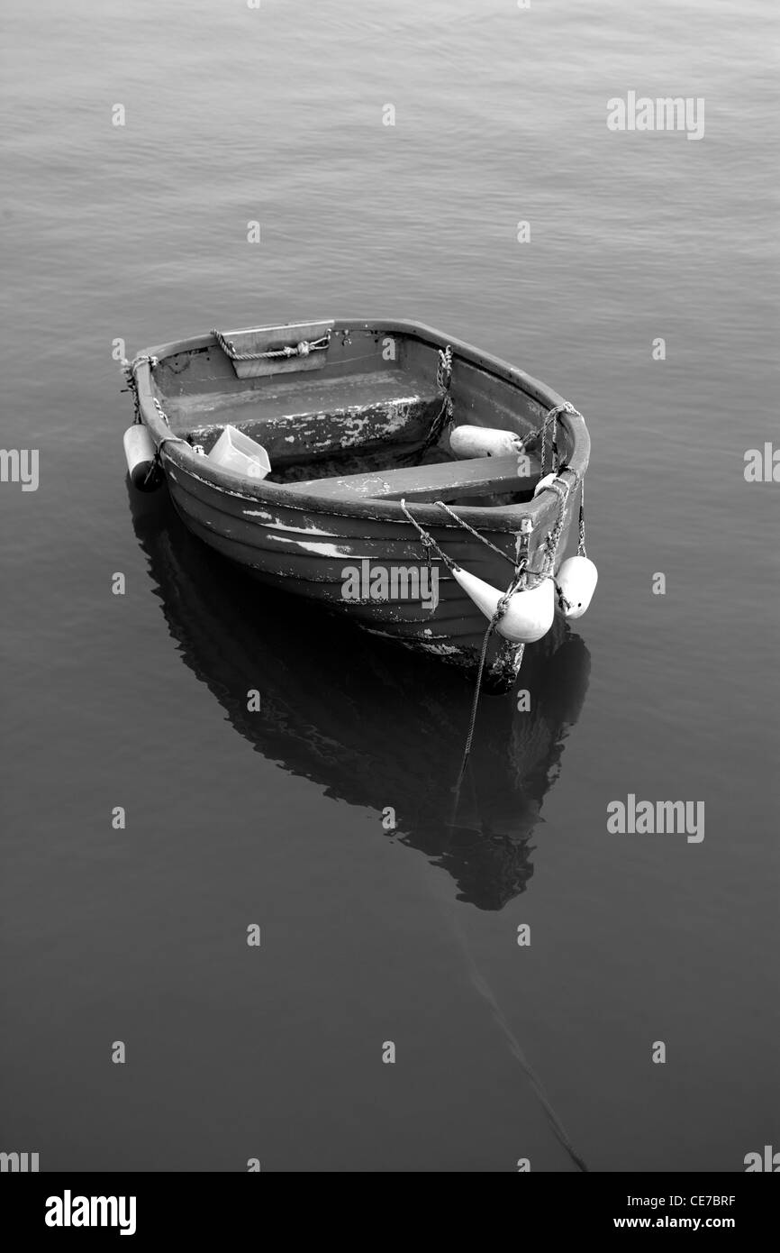 A small boat in Lyme Regis harbour on the jurassic Dorset coast Stock ...