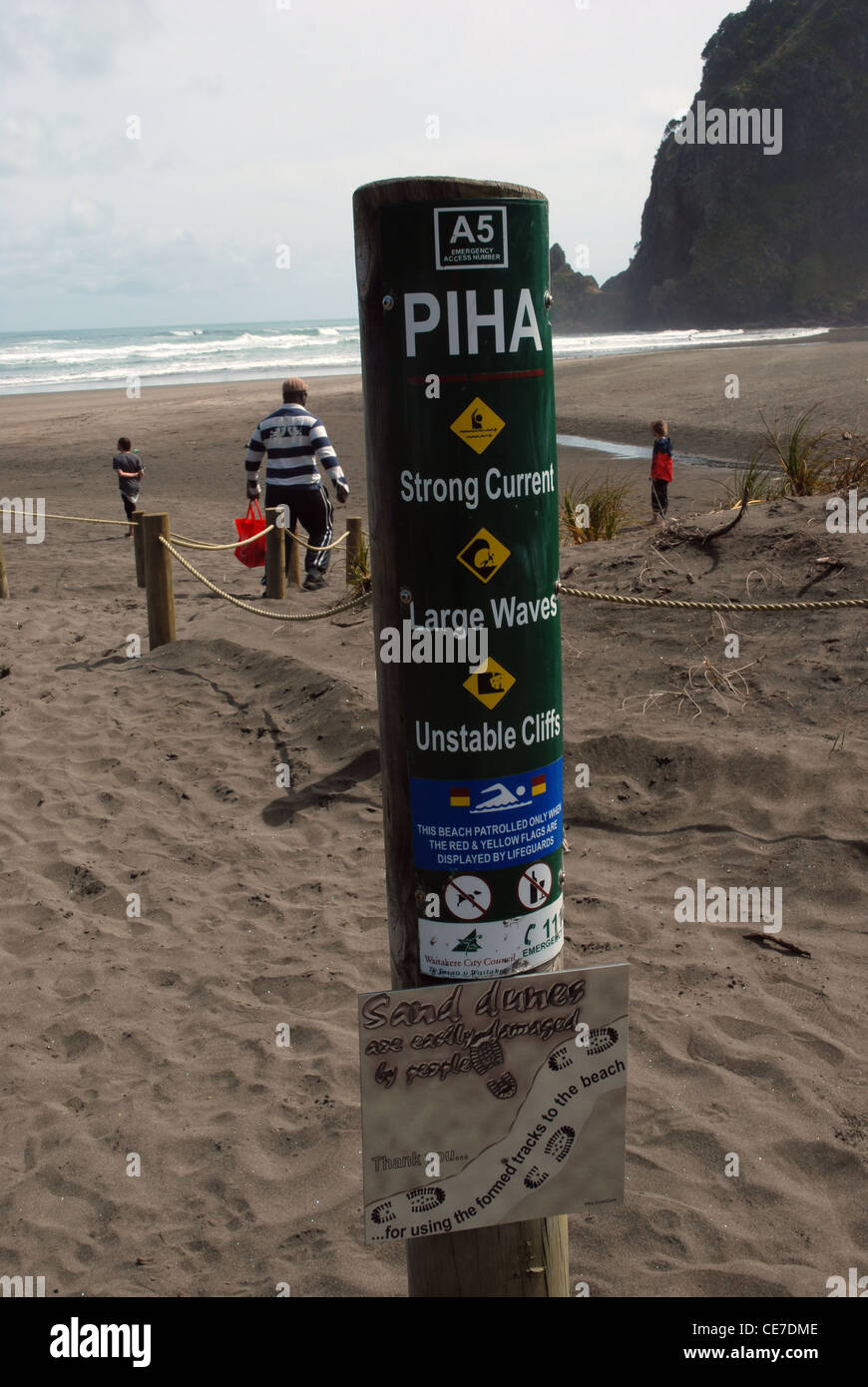 Warning of Strong Currents sign on Piha Beach, New Zealand Stock Photo ...