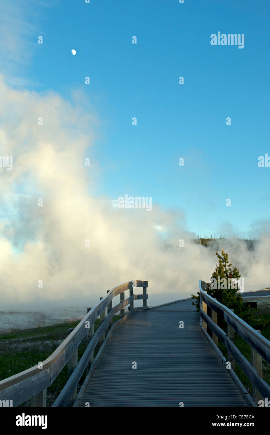 Yellowstone boardwalk and thermals with the moon visible in the sky ...