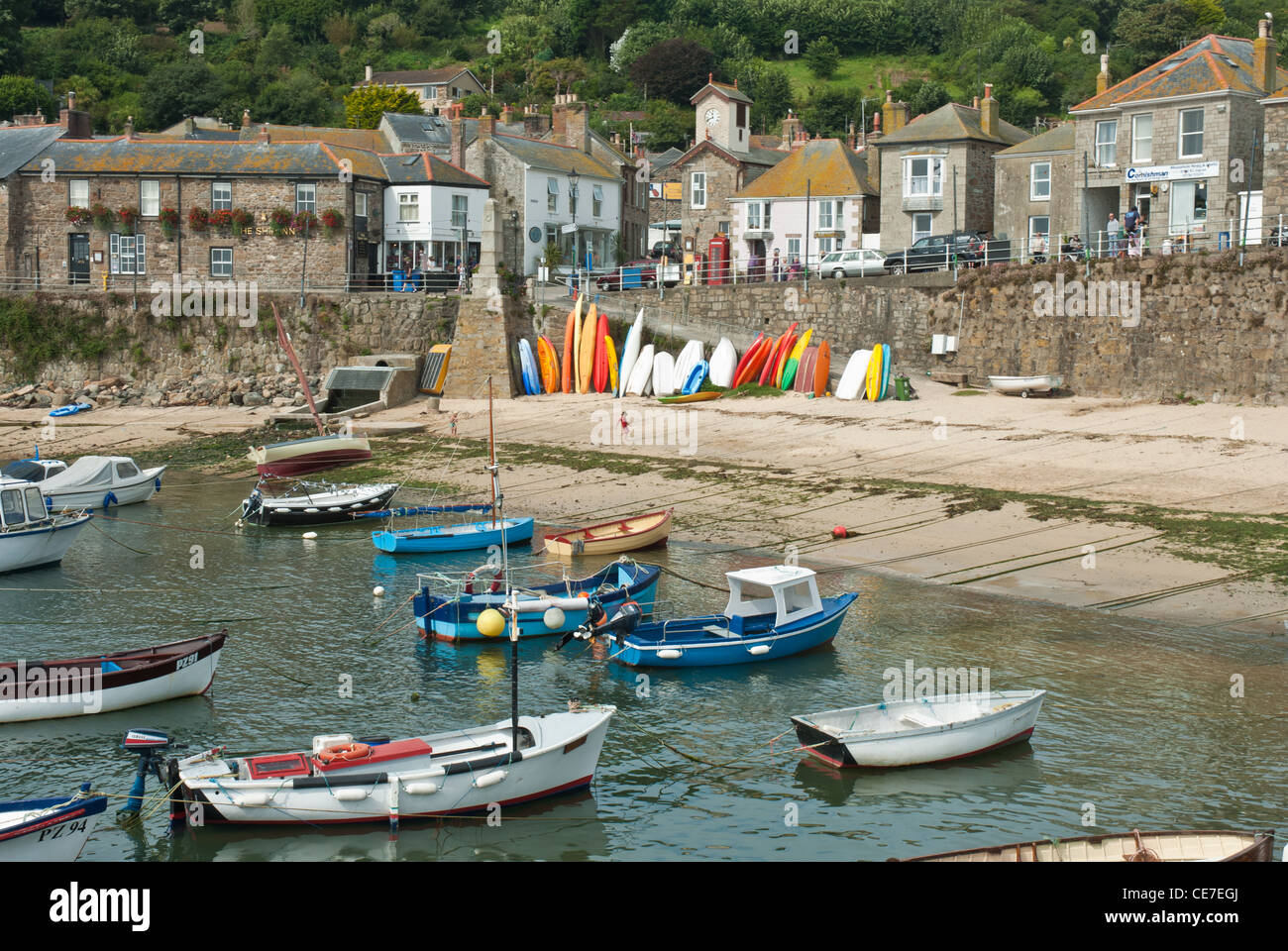 Village of Mousehole Cornwall with harbour front and beach with ...