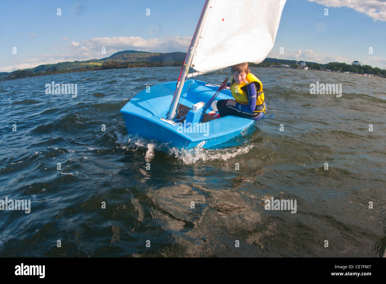 Boy Sailing Optimist Stock Photo - Alamy