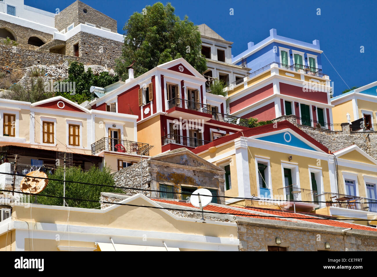 Traditional greek colorful houses in symi island Stock Photo - Alamy