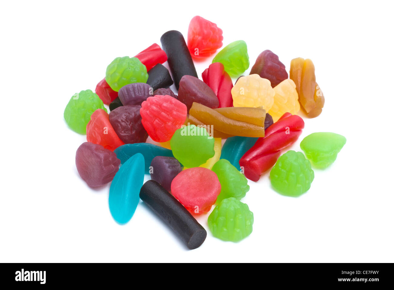 Colorful fruits candy closeup on white background Stock Photo - Alamy