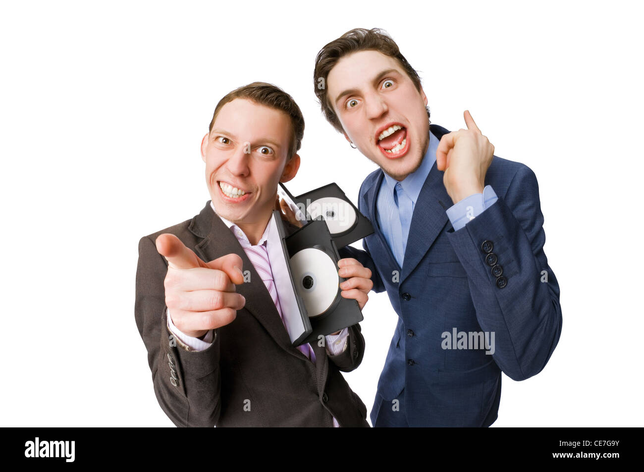 Two young people offering DVDs for sale on white background Stock Photo ...