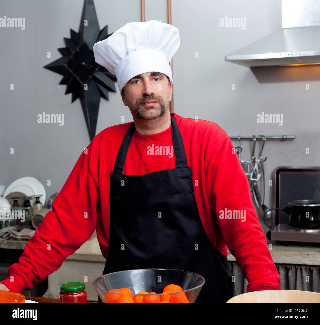 Chef man portrait with mustache in black and red on the kitche Stock ...
