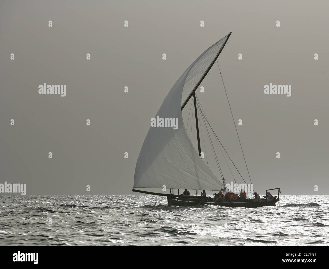 A traditional racing dhow in the Arabian Gulf moonlight off Dubai Stock ...