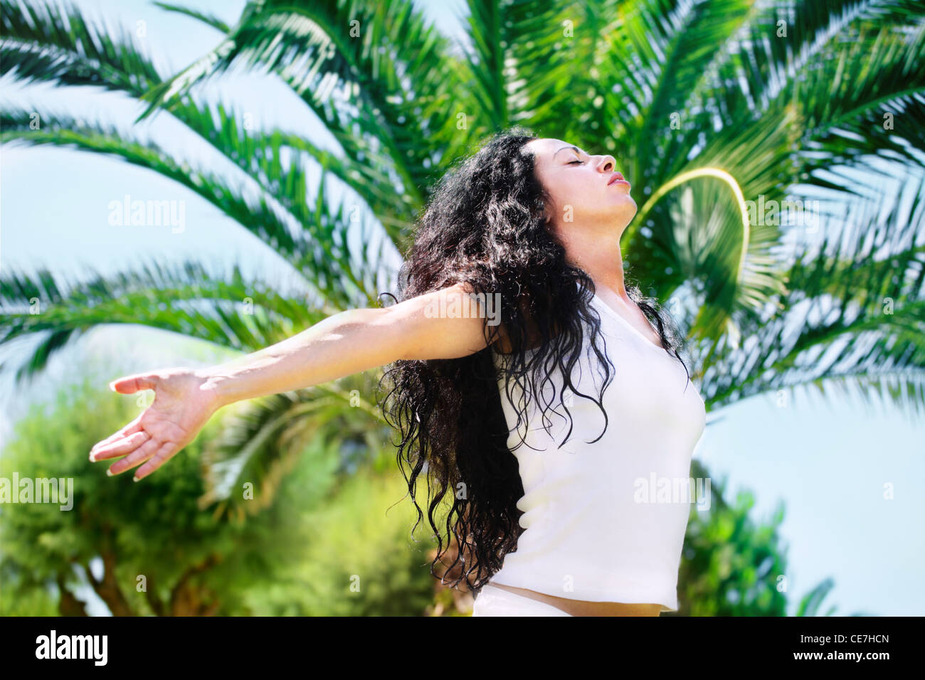 Beautiful young woman relaxing Stock Photo - Alamy