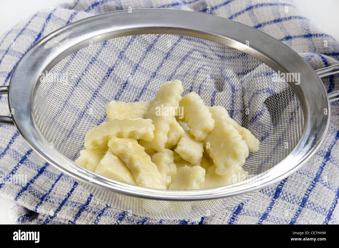 homemade pasta in a colander to drip off Stock Photo - Alamy