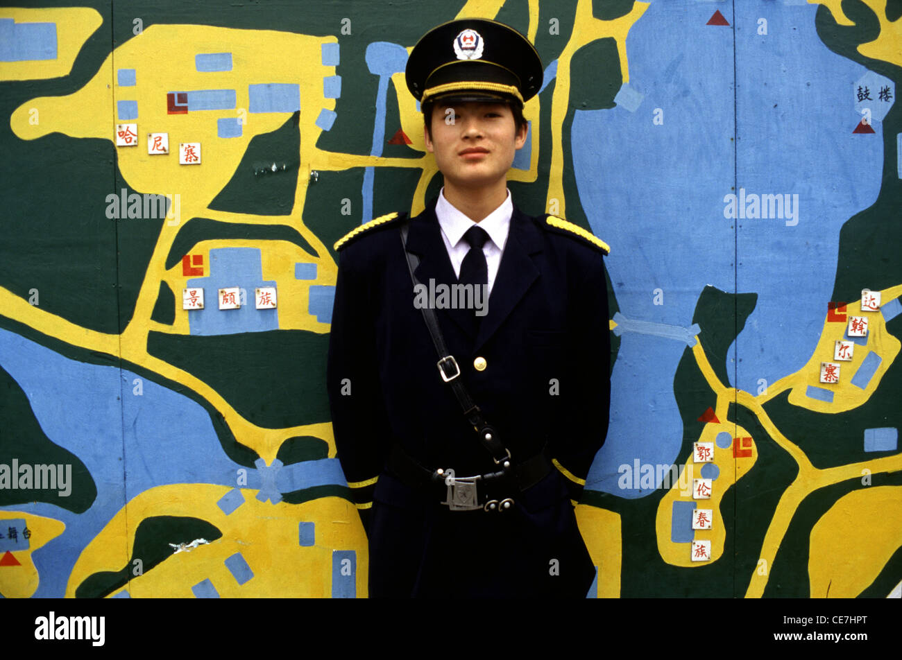 A security guard poses in front of the 'Minority Folklore Entertainment ...