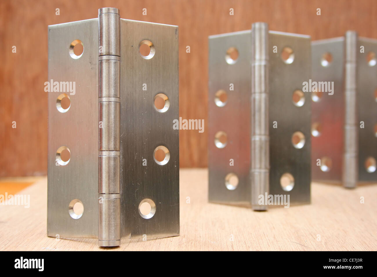 A set of three steel hinges Stock Photo - Alamy