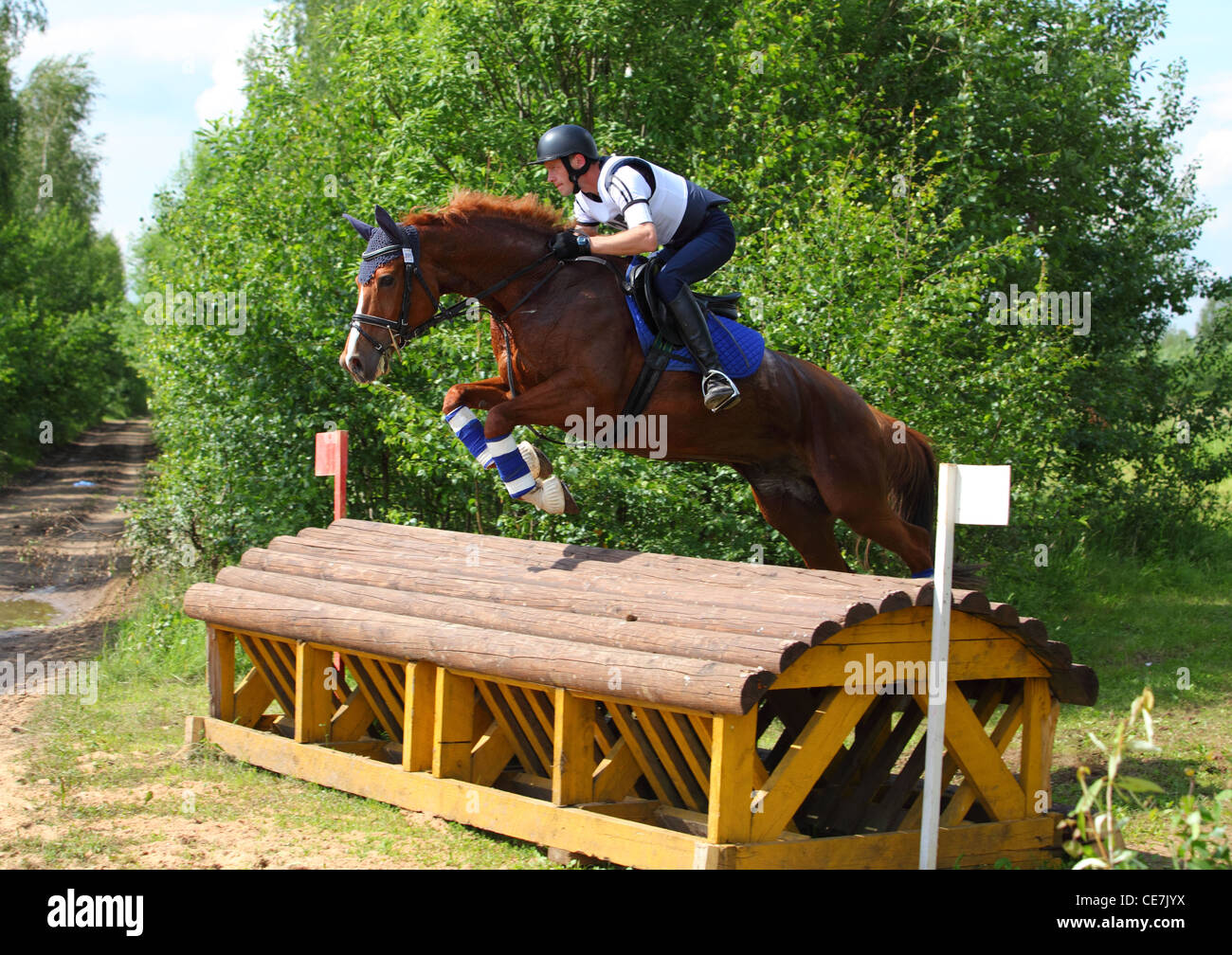 Horse and rider jumping an obstacle at a three day Eventing Competition ...