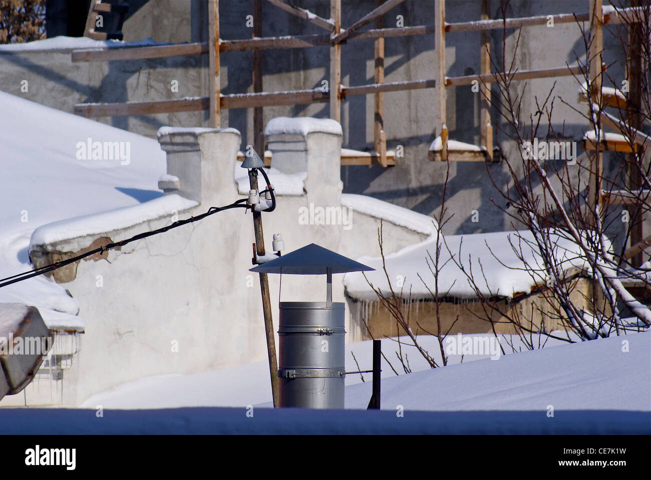 Rooftop chimney in snow, Romania. Is this the worst winter for energy ...