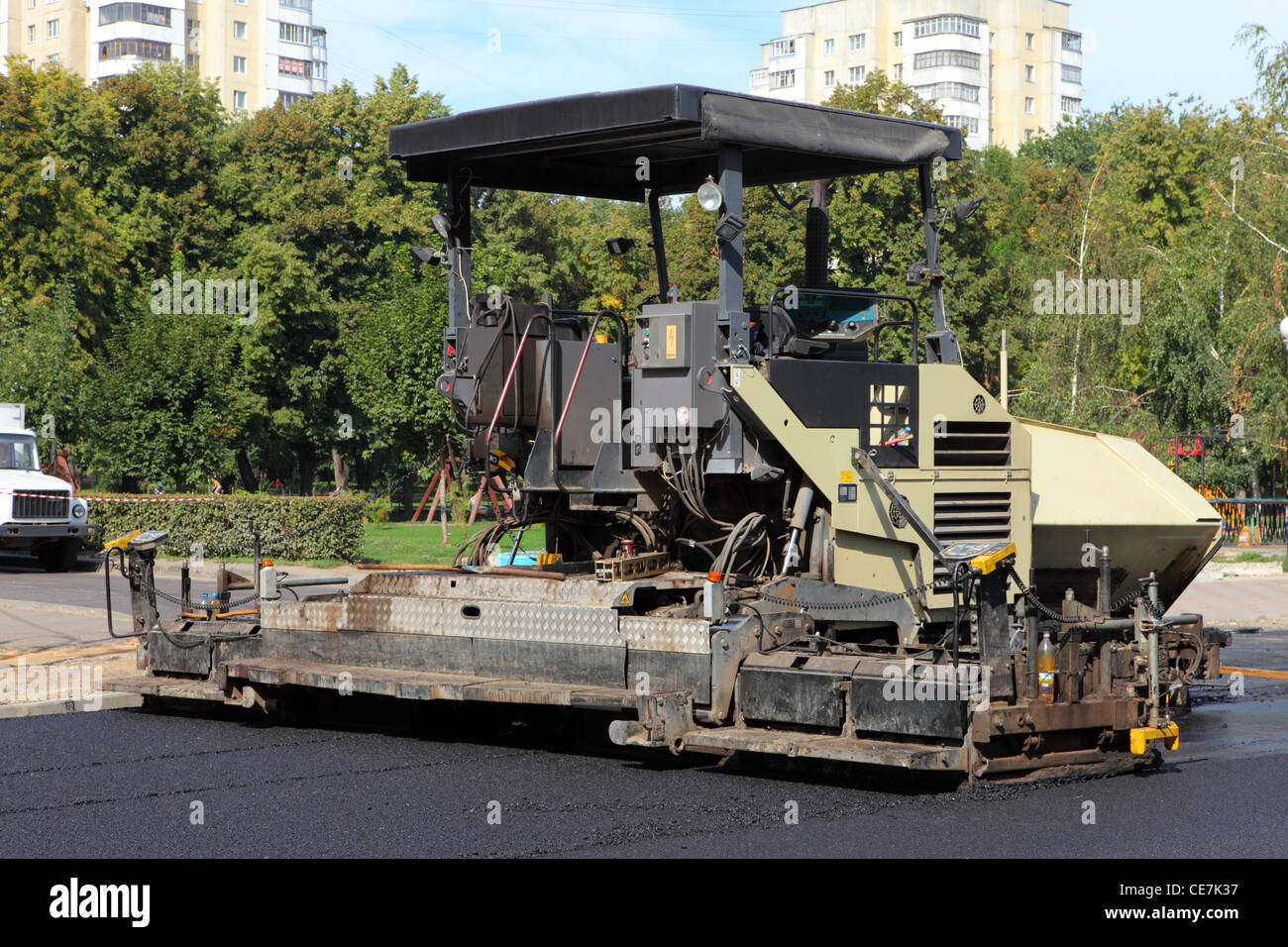 Automatic asphalt spreader on a hot summer day Stock Photo - Alamy