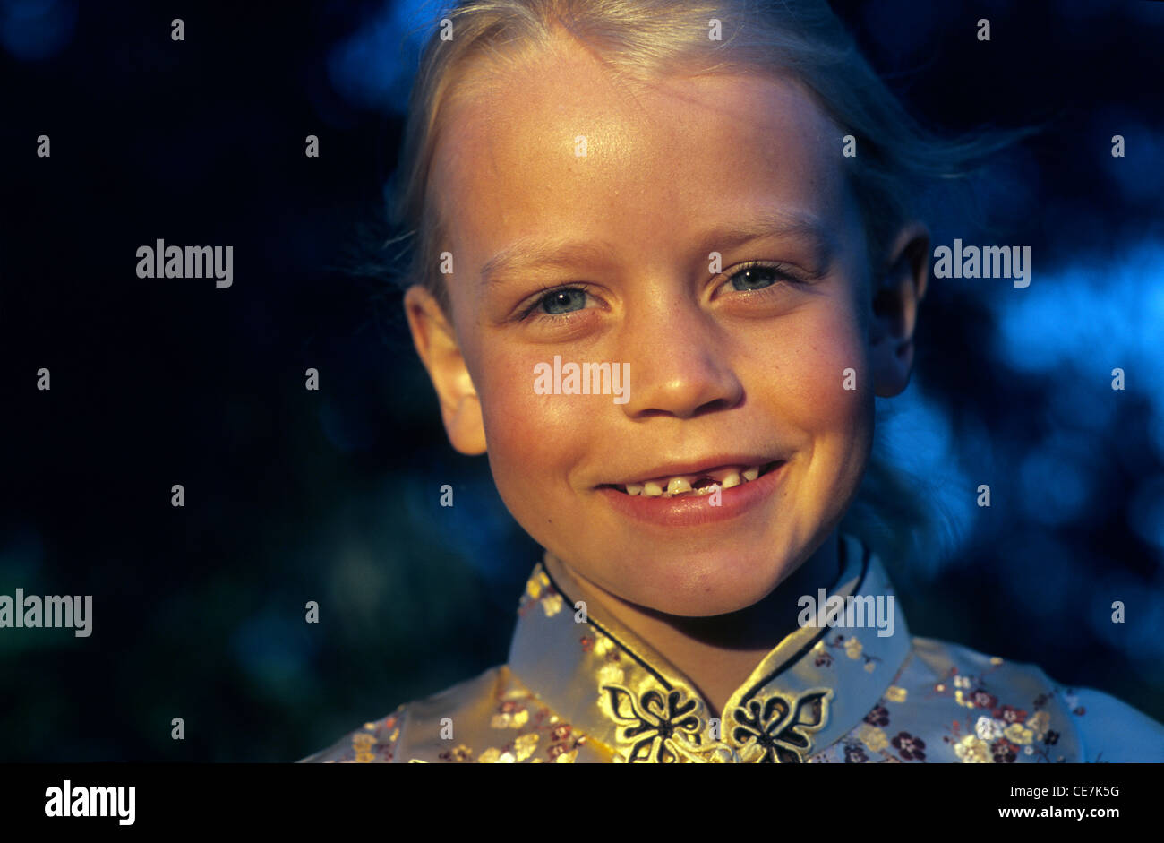 Smiling blonde girl missing tooth hi-res stock photography and images - Alamy