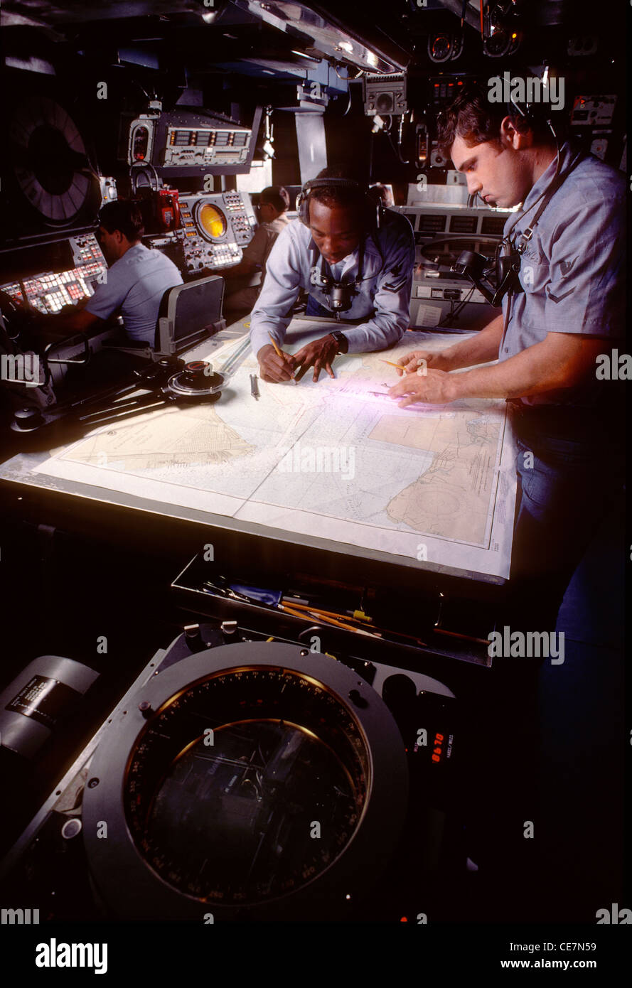US Navy sailors in the weapons control room of the USS Billy Kidd, (DD ...